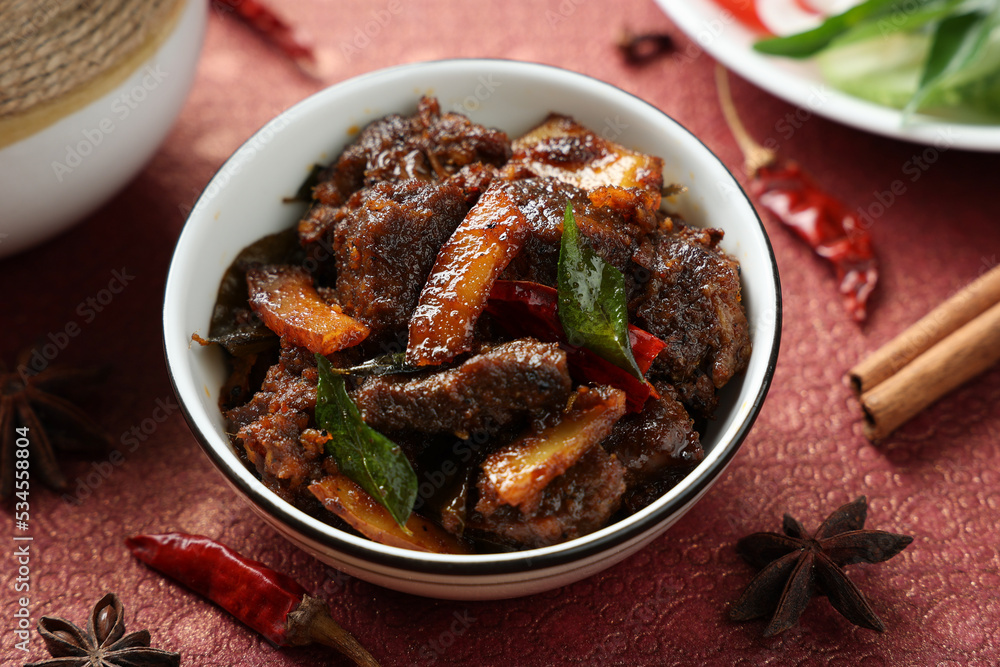 Spicy red beef fry curry and brown rice South Indian dish Kerala, India ...