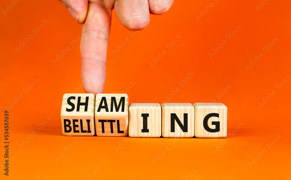 Shaming and belittling symbol. Concept words Shaming and Belittling on ...