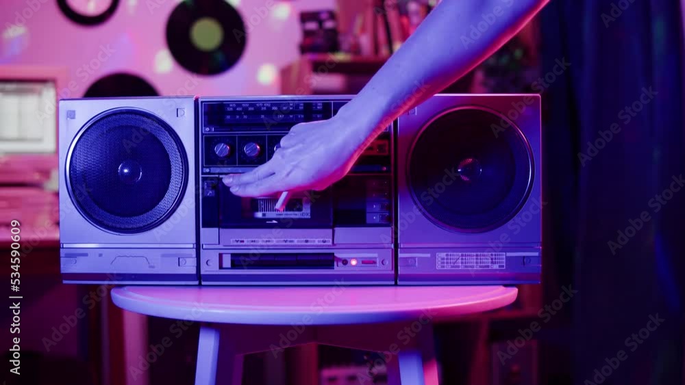 Retro radio tape recorder, putting cassette close-up. Listening to ...