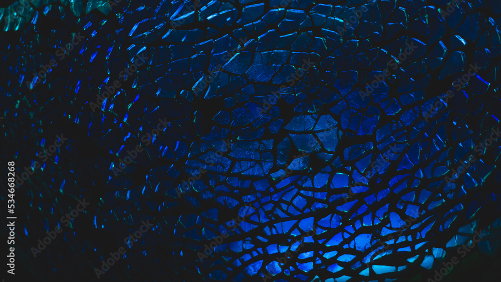 Shattered transparent glass pattern in the dark. abstract cracked ...