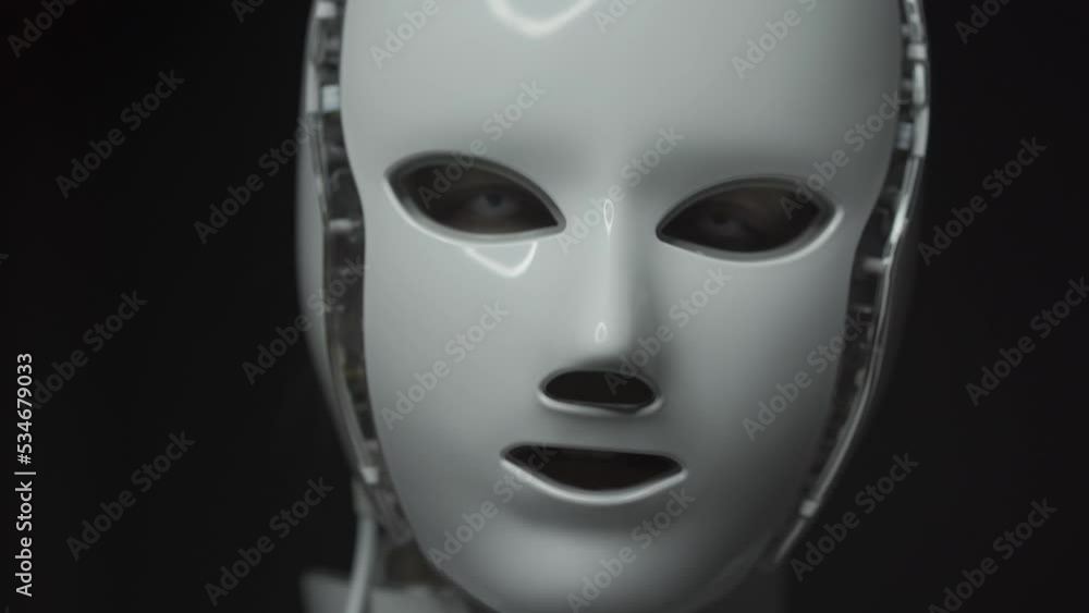 Artificial intelligence. Futuristic humanoid robot is activated, moves ...