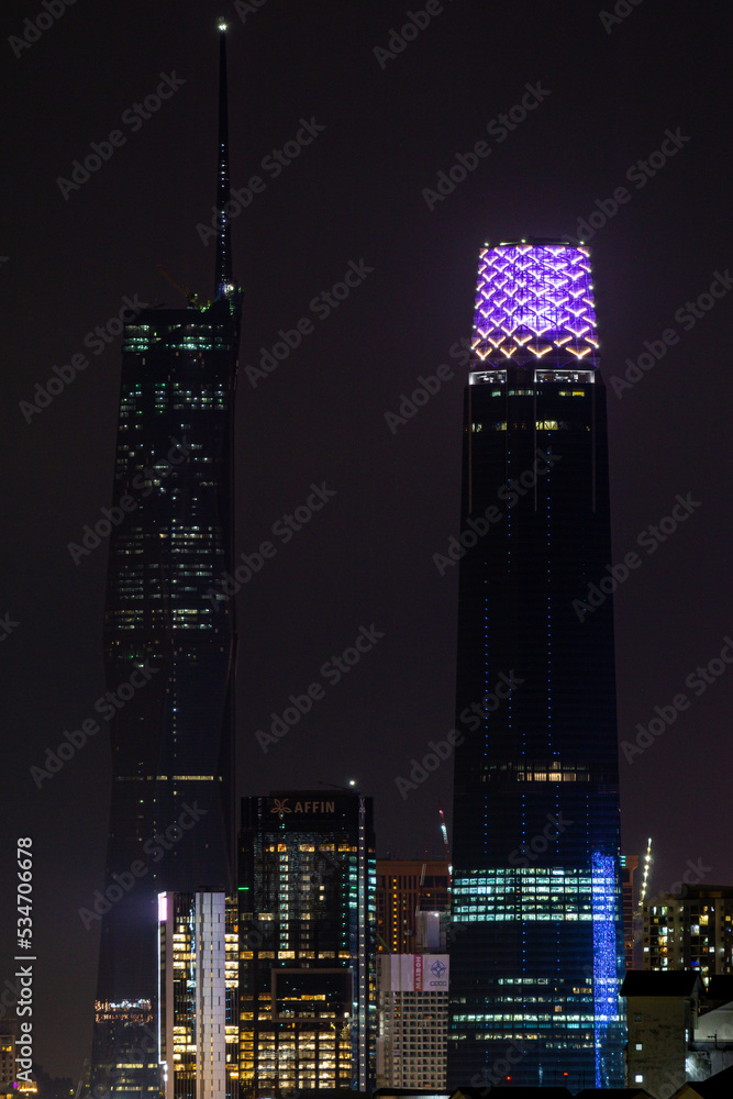 View of PNB 118 and Exchange 106 at night. PNB 118 also known as ...