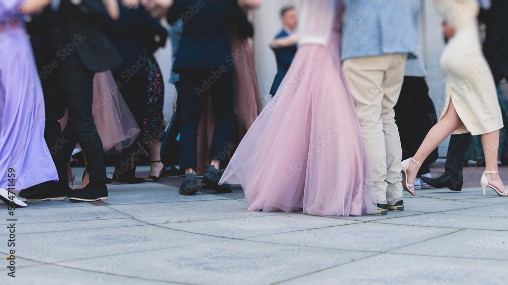 High school graduates dancing waltz and classical ball dance in dresses ...
