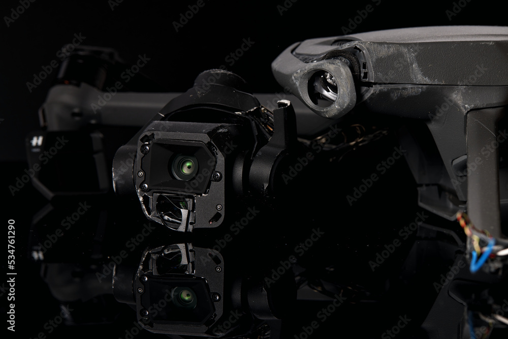 Drone DJI Mavic 3 after crashed on a black background. Drone after ...