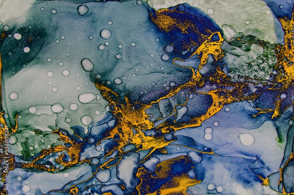 Golden powder and ink floating in veins of Alcohol ink fluid abstract ...