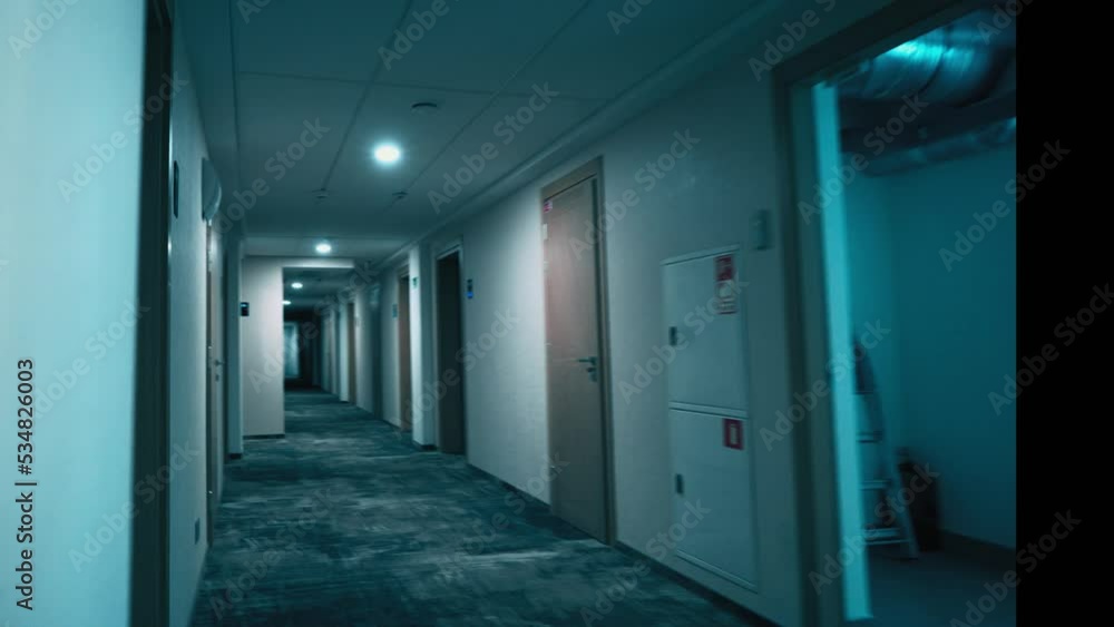4K Terrible hotel corridor. Long and dark corridor. A trembling frame ...