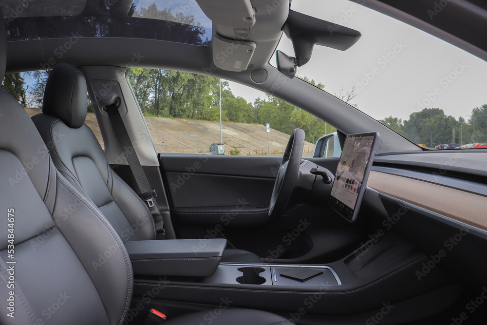 Driver's seat of the interior car Tesla Model Y Stock Photo | Adobe Stock