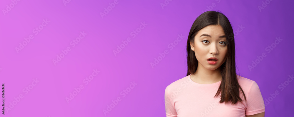 Close-up confused shocked cute young silly asian girl hear strange ...