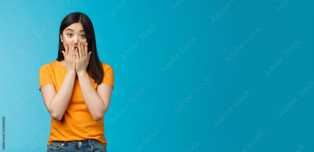 Shocked speechless stunned asian girl stare camera cover mouth palms ...