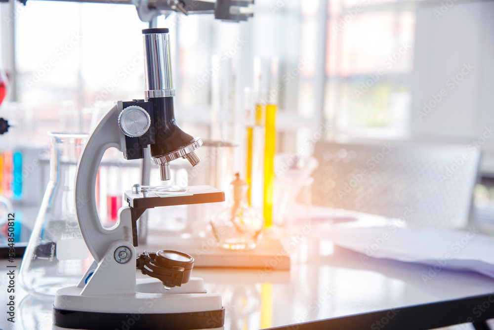 Science microscope equipment in biology chemical laboratory. Scientific ...