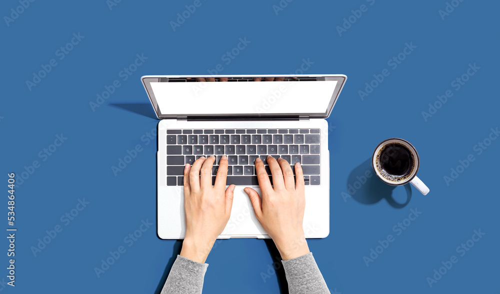 Person using a laptop computer Stock Photo | Adobe Stock