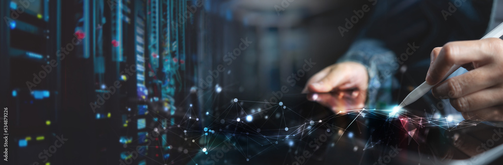 Computer engineer using digital tablet with server room, data center ...