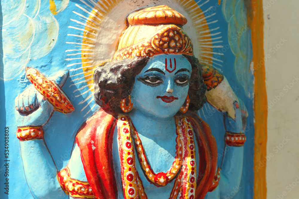 Vishnu on the wall of the temple in Rishikesh. Stock Photo | Adobe Stock
