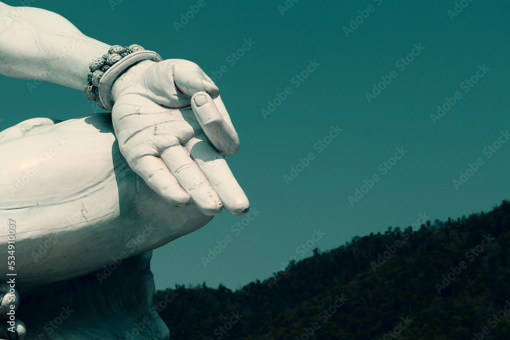 Fragment of a statue of Shiva meditating in lotus position. Shiva's ...