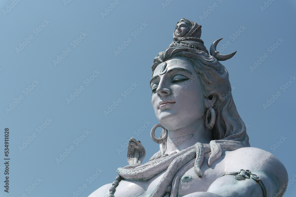 Beautiful big statue of meditating Shiva. Lord Shiva sits near the ...