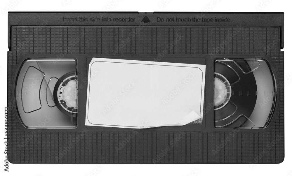Old vintage vhs video cassette tape with a blank paper label. Magnetic ...