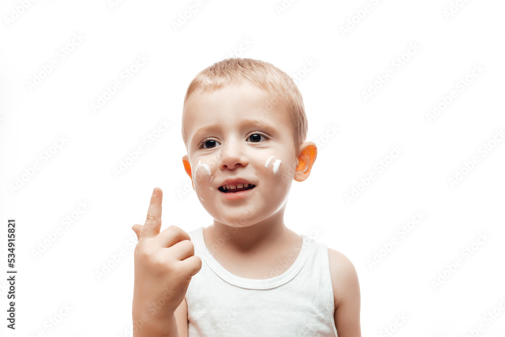 applying moisturizing cream on baby face on white background. Care ...