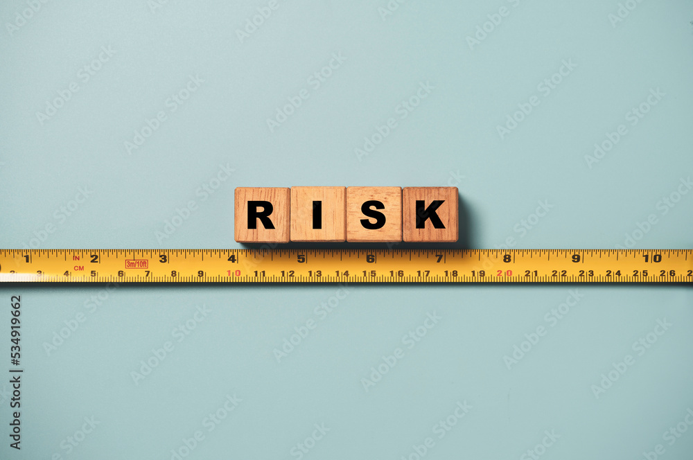 Risk wording print screen to wooden block cubes with yellow tape ...