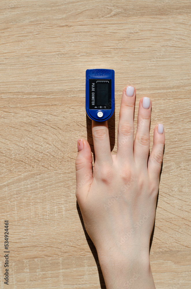 Pulse oximeter. Medical device on the finger. Patient diagnosis. Covid ...