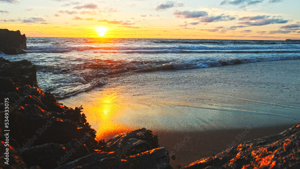 Beautiful natural landscape with sandy beach with big stones during ...