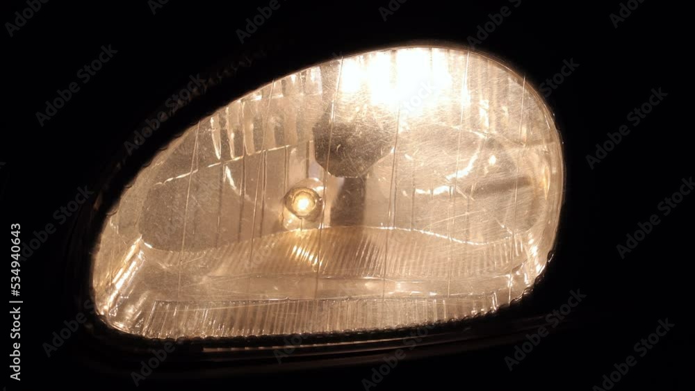 Car headlight shines at night, headlight light close-up. Front lamp ...