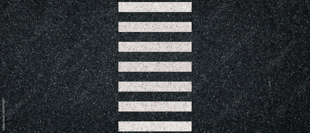 asphalt road with pedestrian crossing white lines. Dark gray textured ...