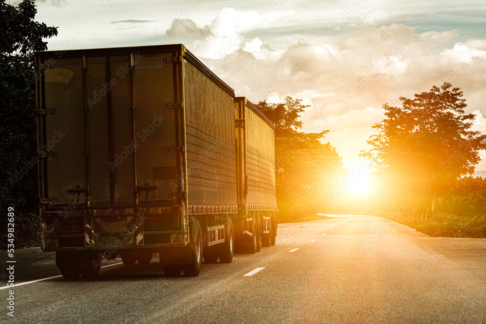 Beautiful truck tractor with a semitrailer transports cargo against the ...