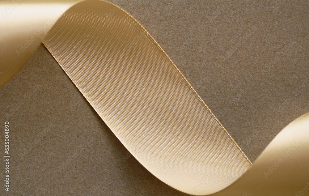 close up macro antique satin golden silk fabric ribbon texture abstract ...