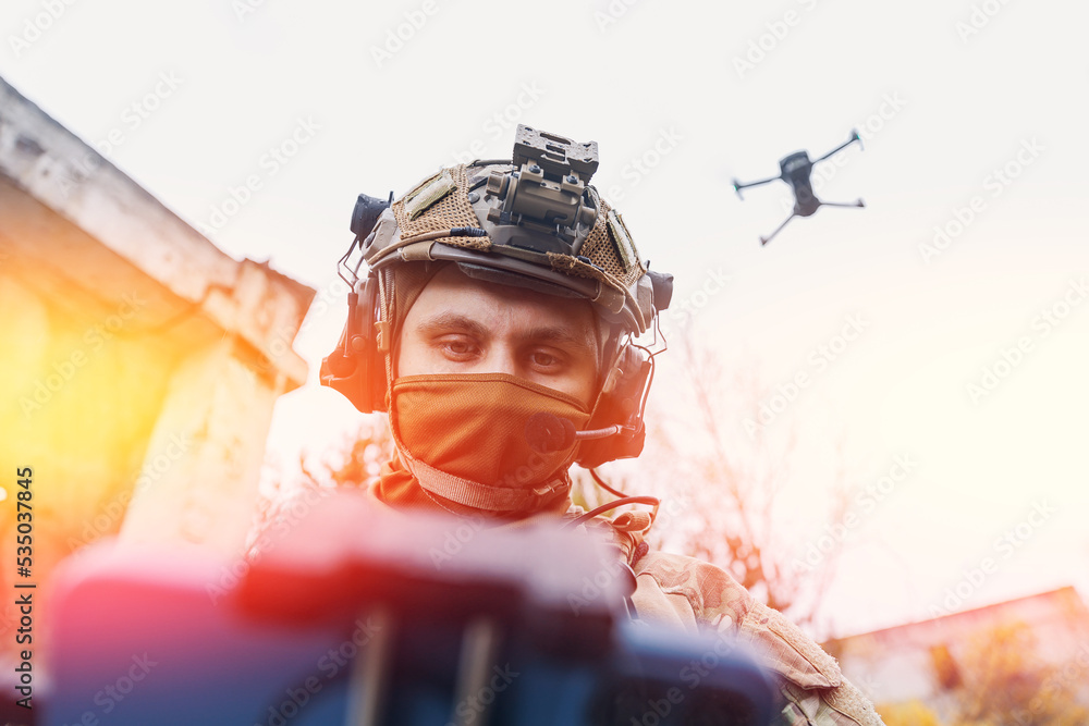 Modern army soldiers using aerial drone for artillery guidance and ...