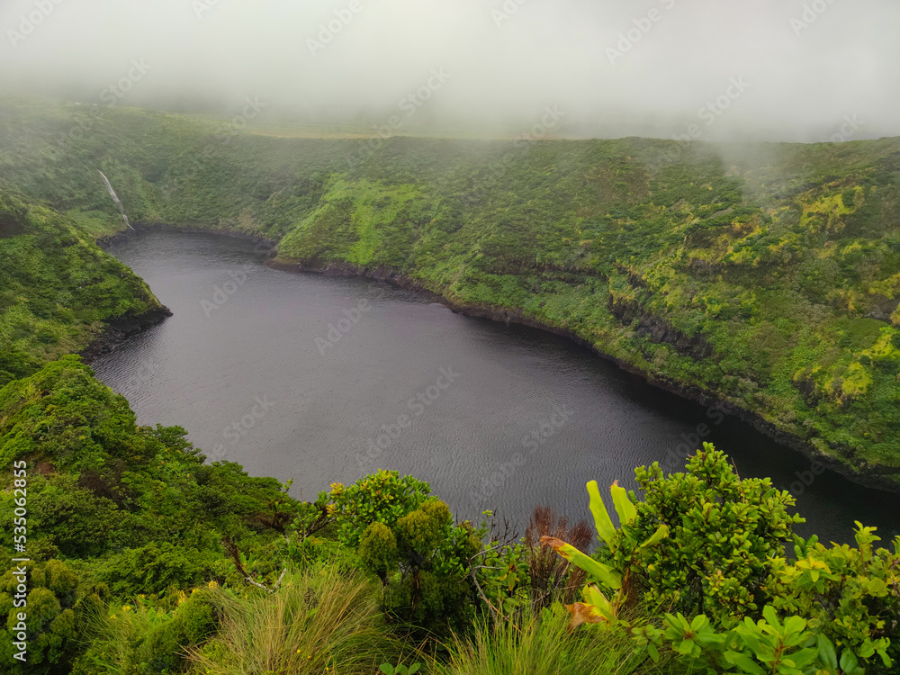 Twin volcano crater lakes at foggy day, Lagoa Negra (black lagoon) and ...