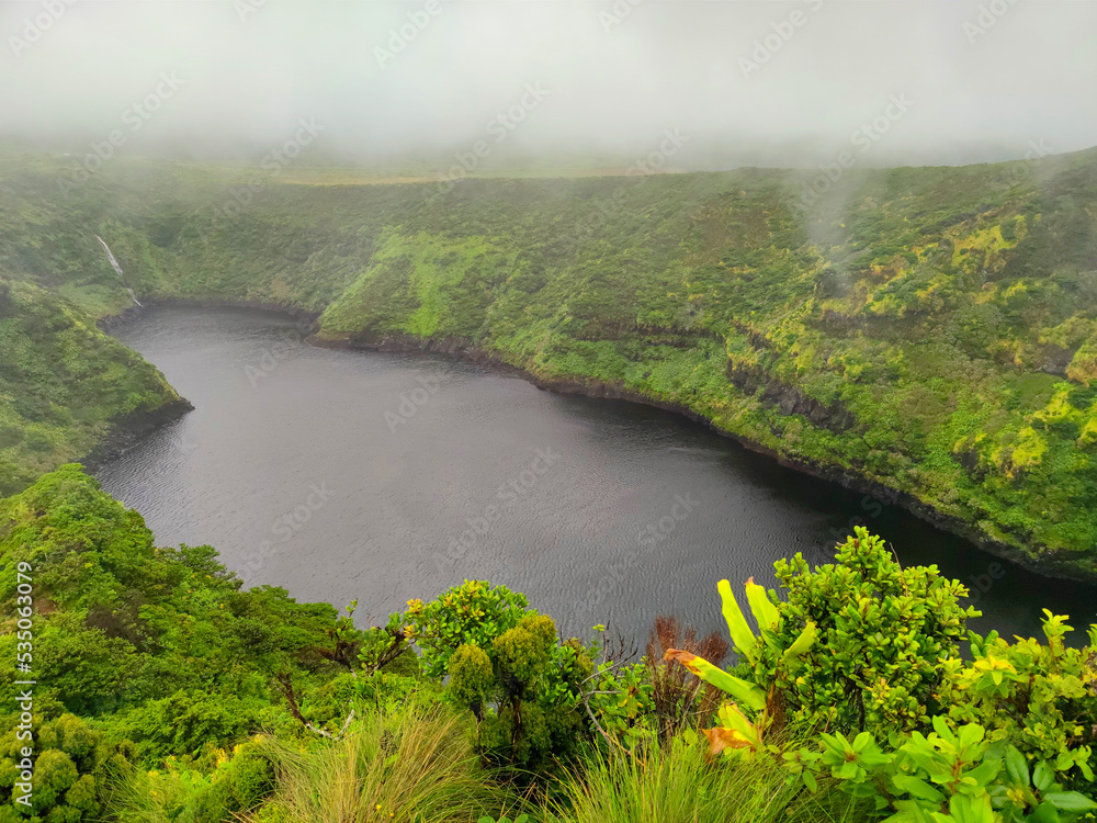 Twin volcano crater lakes at foggy day, Lagoa Negra (black lagoon) and ...