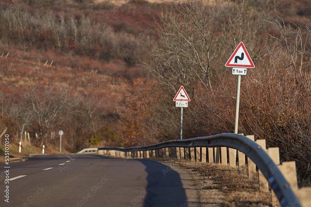 Poster Rural road traffic signs warning about bends – Wall Art | UkPosters