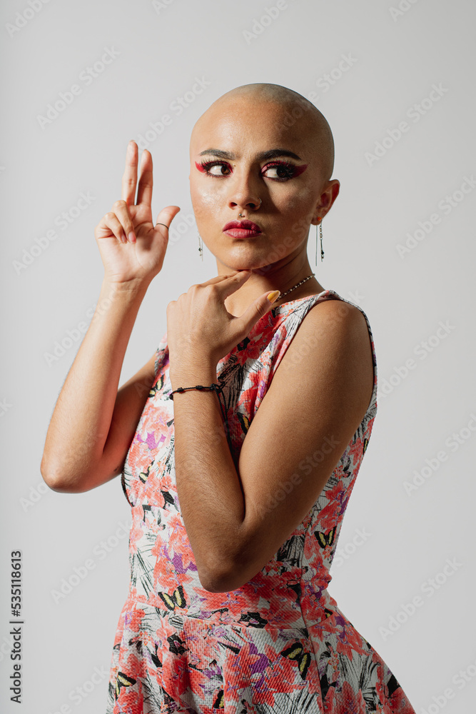 Portrait of a bald girl in a flower dress. Young hairless teenager sure ...