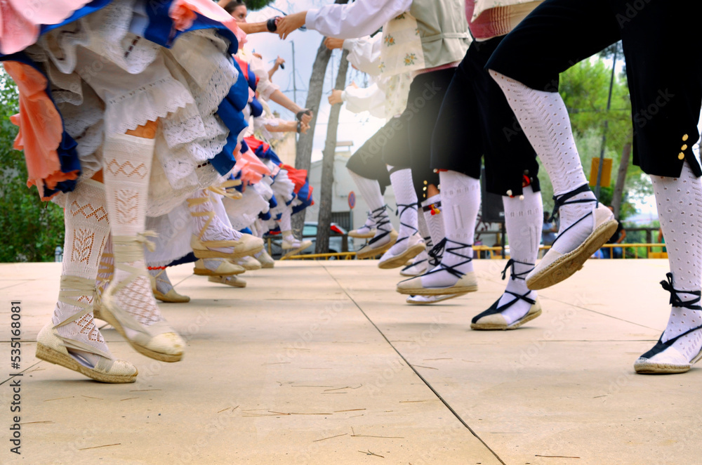 Folkloric dance. Men and women dancing in traditional costumes. Stock ...