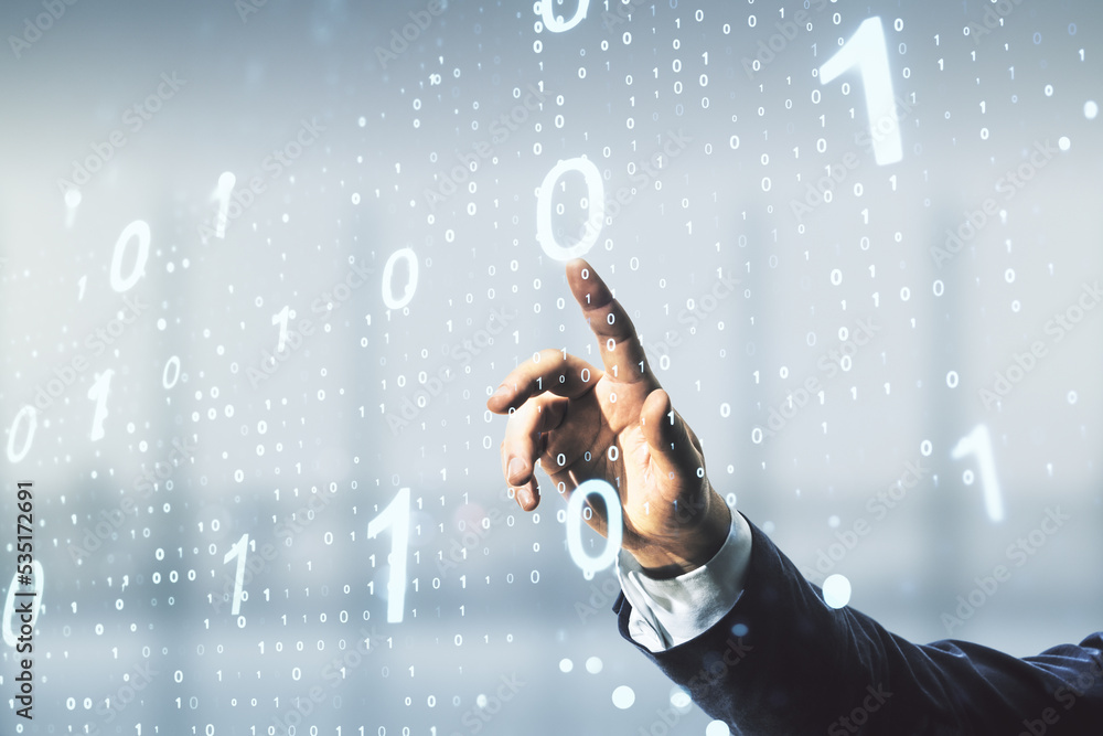 Male hand working with abstract virtual binary code sketch on blurred ...