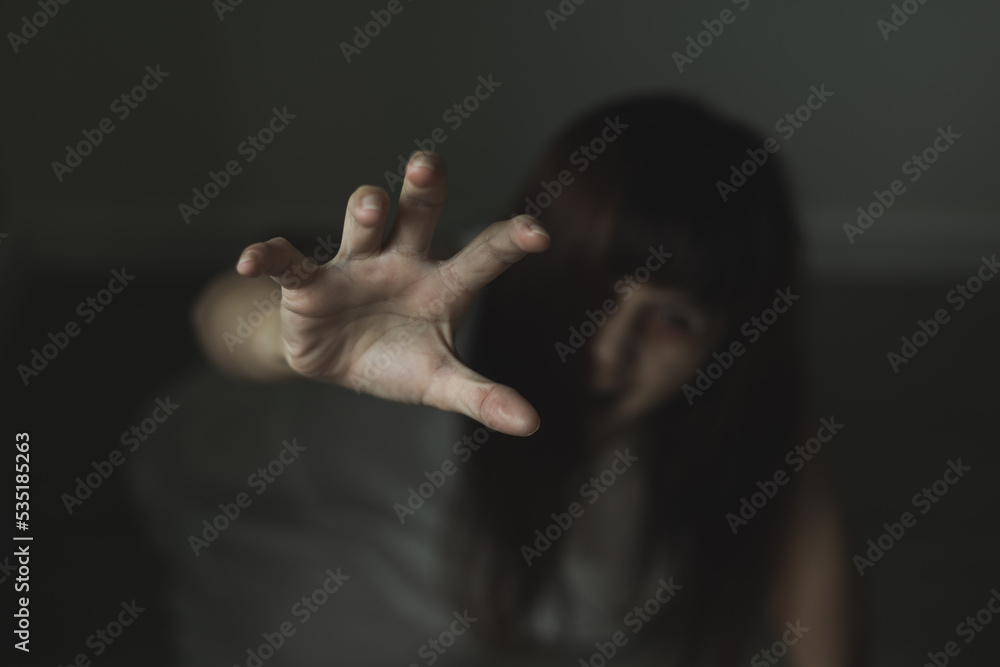 Female ghost in white dress in room. A young scary girl in an old white ...