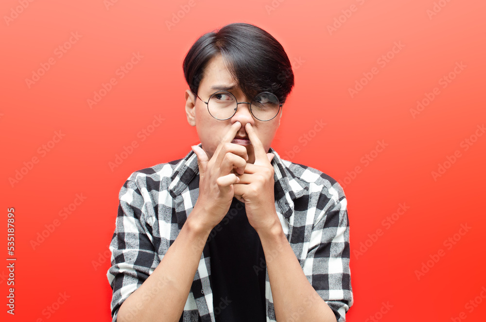 Ew Its So Gross A Young Asian Man In A T Shirt Stands Over An Empty