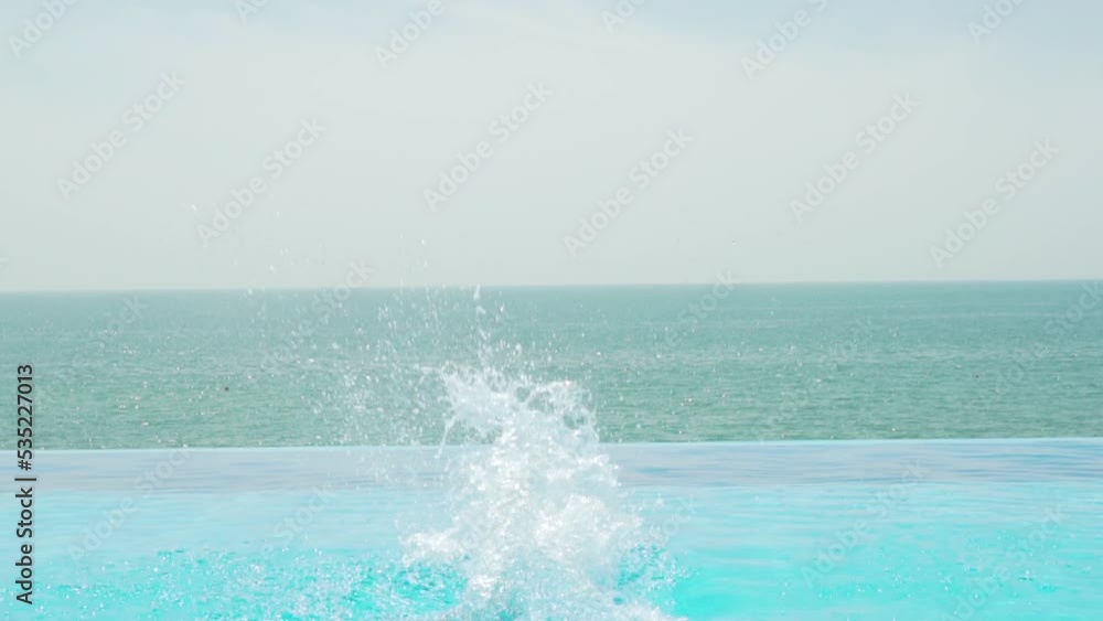 Happy Kid Jumping Bombshell into Outdoor Infinity Pool Water. Little ...