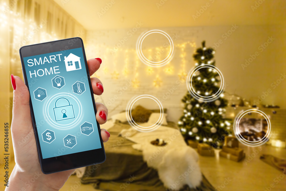 Smart home technology interface on smartphone app screen with augmented ...