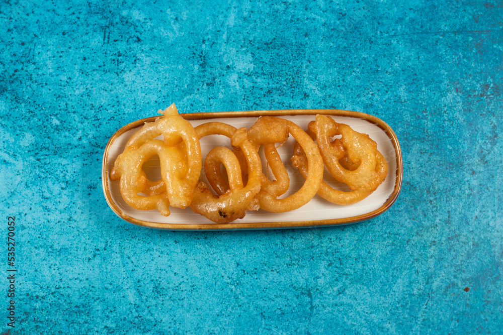 indian sweets deep fired jalebi, jilipi, jilabi served in a dish ...