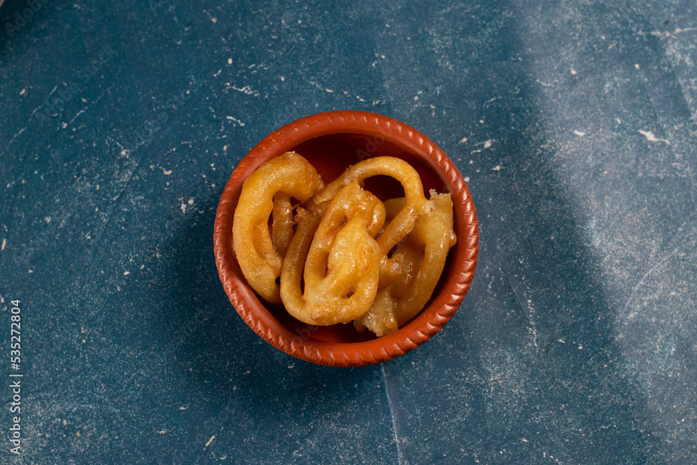 indian sweets deep fired jalebi, jilipi, jilabi served in a dish ...