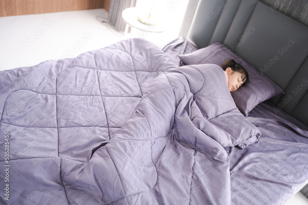 asian children girl person are sleep on bed at home, little young cute ...