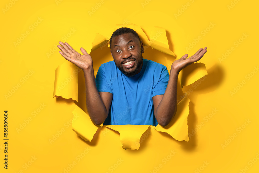 I don't know. African american man shrugging shoulders and spreading ...