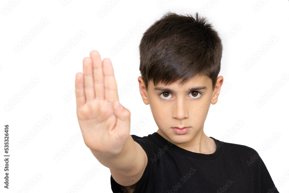 Little caucasian kid standing with outstretched hand showing stop sign ...