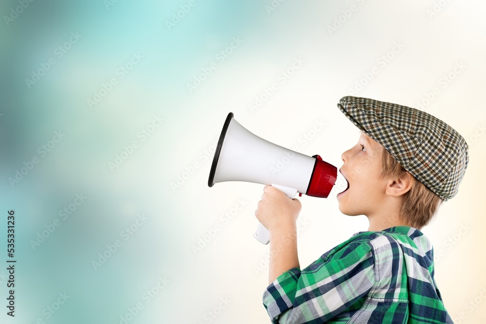 Portrait of young fun smart happy boy hold megaphone loudspeaker back ...
