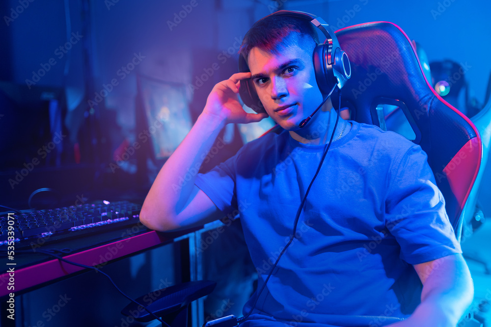 Streamer young man rejoices in victory professional gamer playing ...