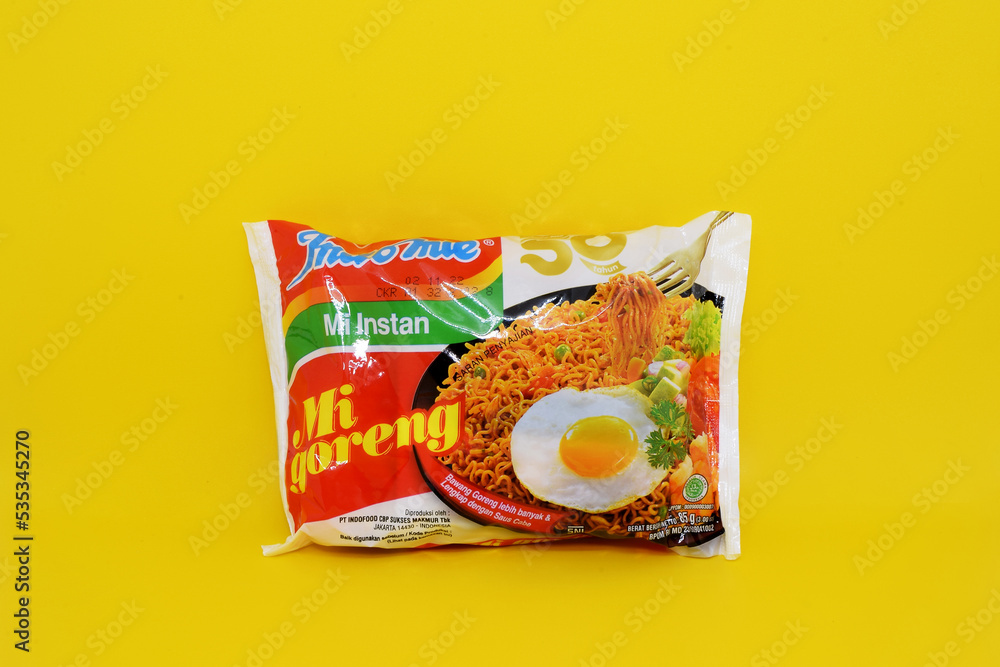 Indomie goreng instant noodles photo on a yellow background on October ...