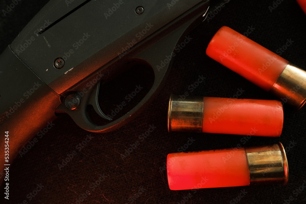 Trigger of a rifle on black background with red lightning with Shotgun ...