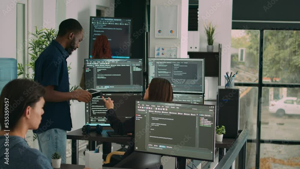 Diverse Team Of Database Developers Analyzing Code On Terminal Window Working With Html Script