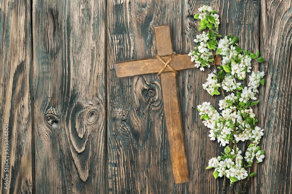 Christian cross and border of flowers on a desk background Stock Photo ...